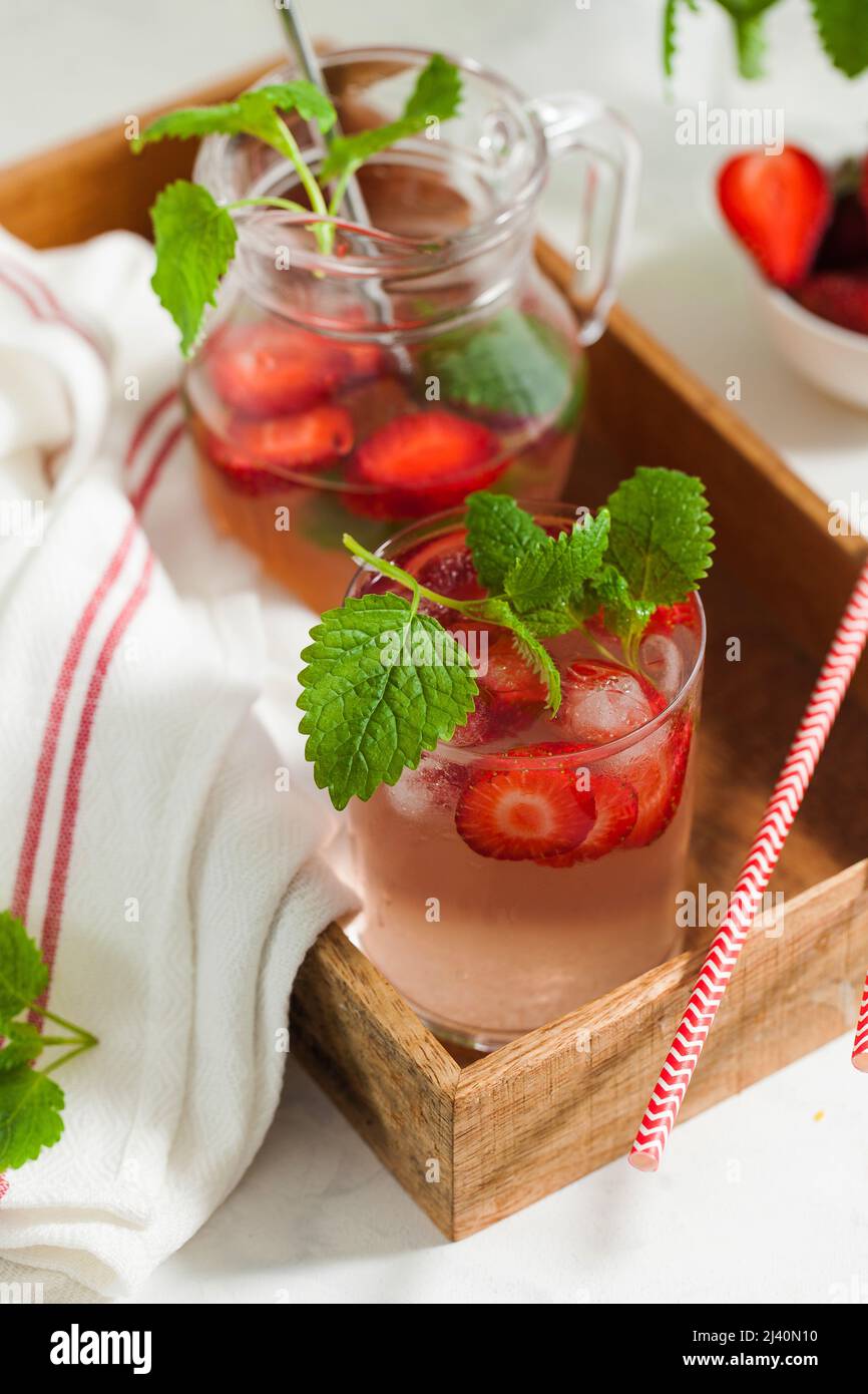 Homemade refreshing strawberry lemonade in pitcher and glass Stock ...