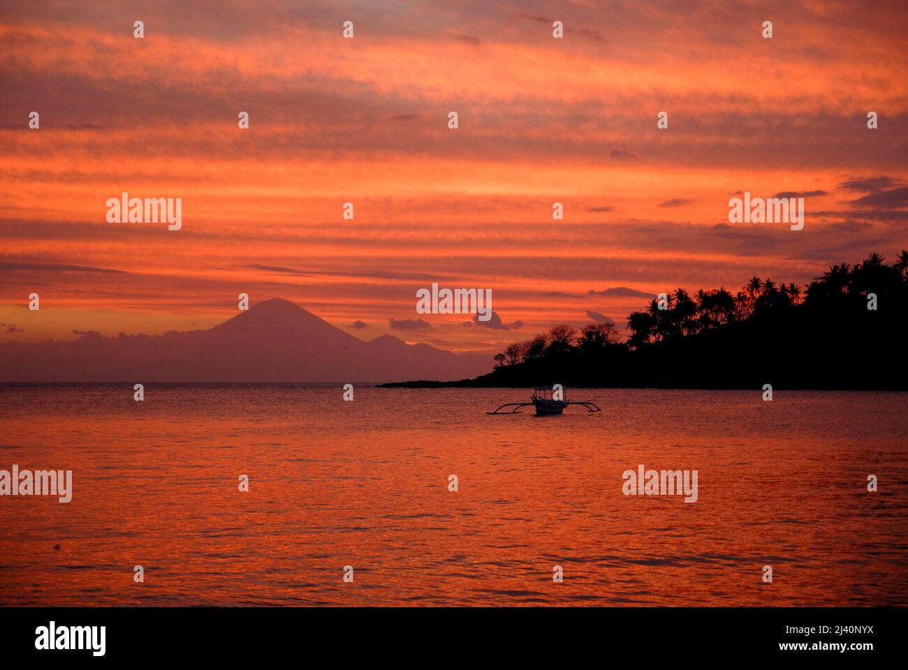 Looking across Lombok Strait toward Bali at sunset from Senggigi Beach ...