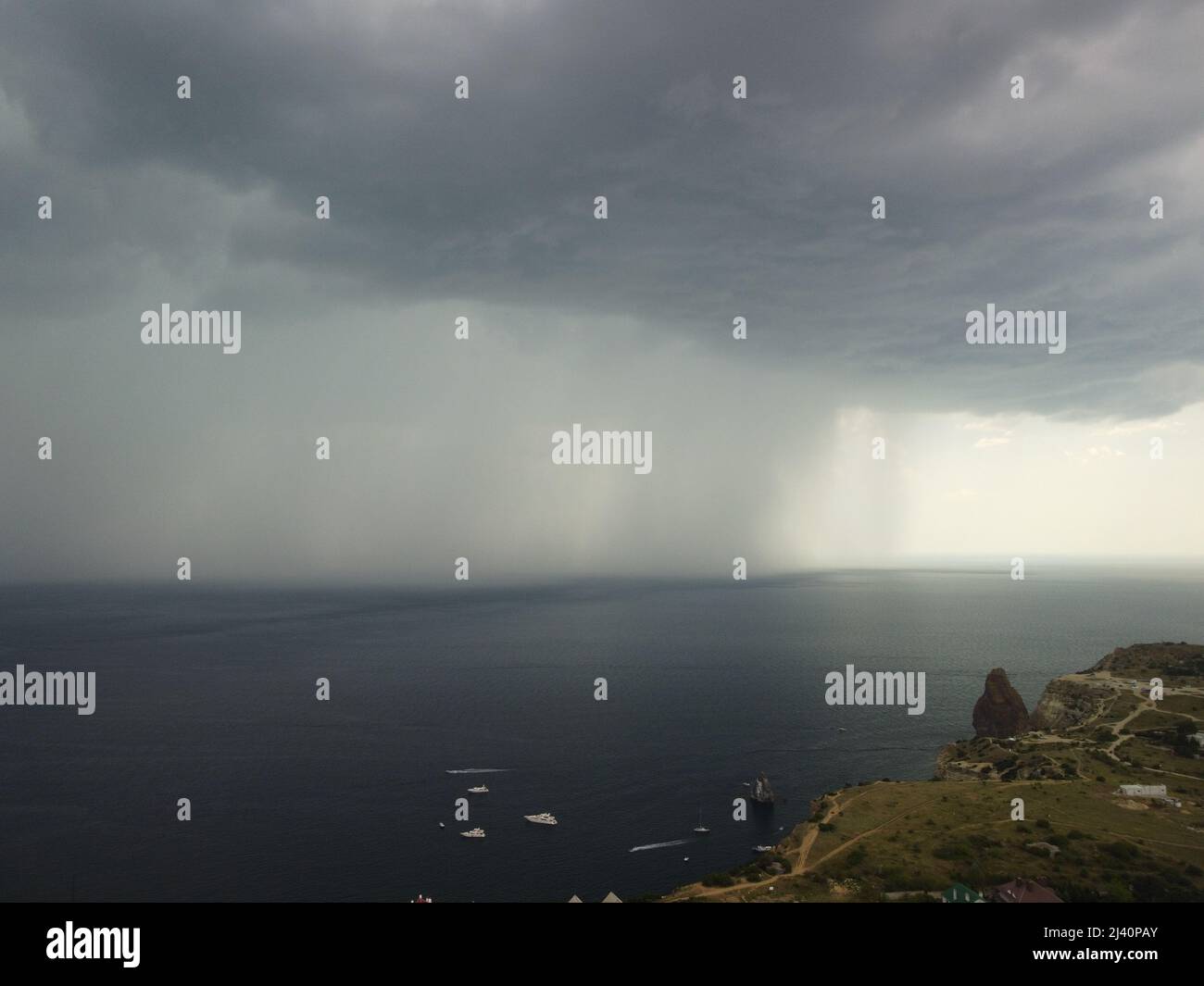 Aerial view footage of rain clouds over sea ocean Black clouds in bad ...