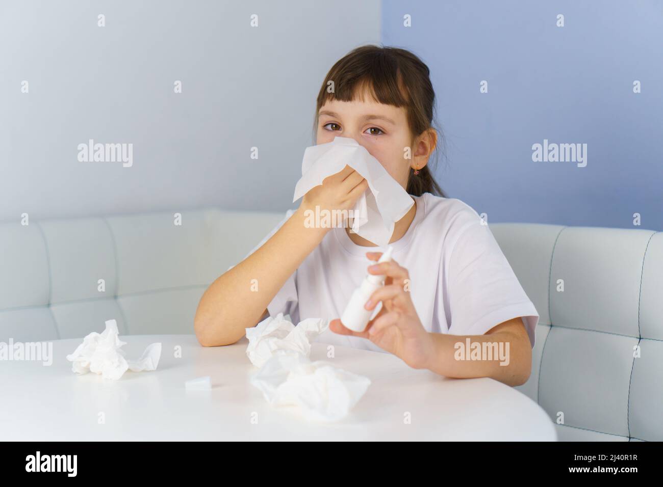Girl blowing nose tissue paper hi-res stock photography and images - Alamy