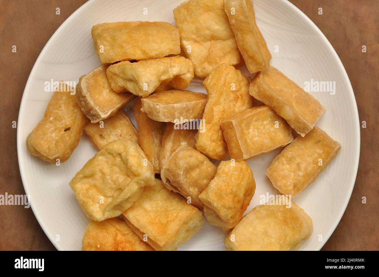 Fried tofu on white plate, closeup of fried tofu on the table, table ...