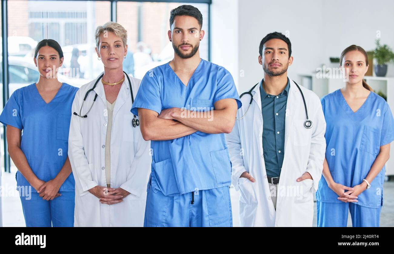 Dont judge each day by the harvest you reap. Shot of a group of doctors ...
