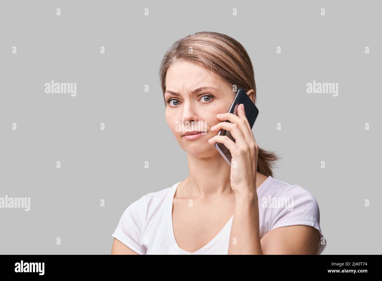 Pretty female portrait. Woman talking by mobile phone. Cute ...