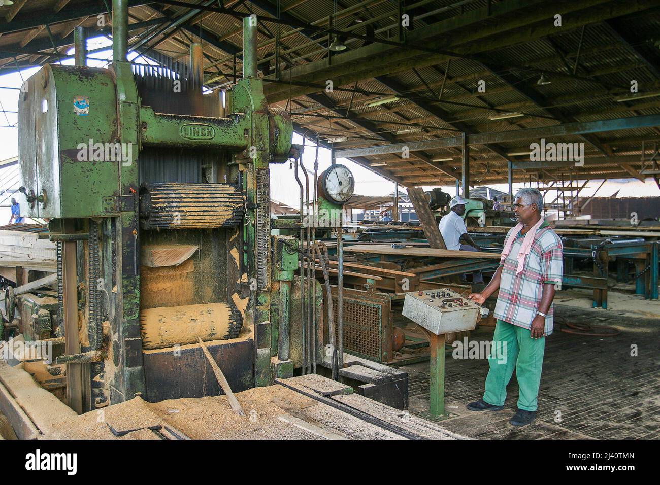 Surinam, Paramaribo - Employees at the saw mill of a timber factory ...
