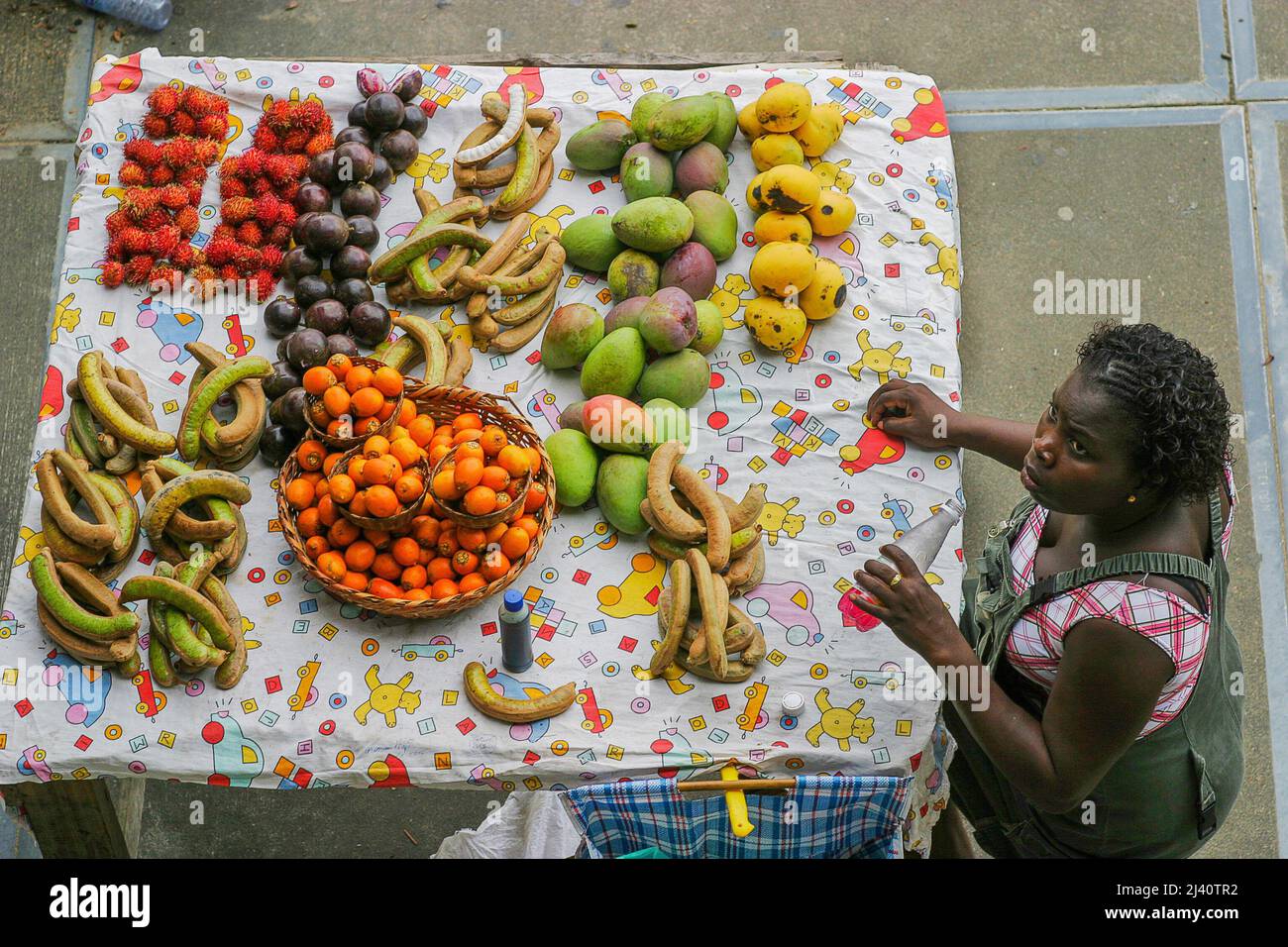 Surinam, Paramaribo - woman is selling fruits on the street Stock Photo ...