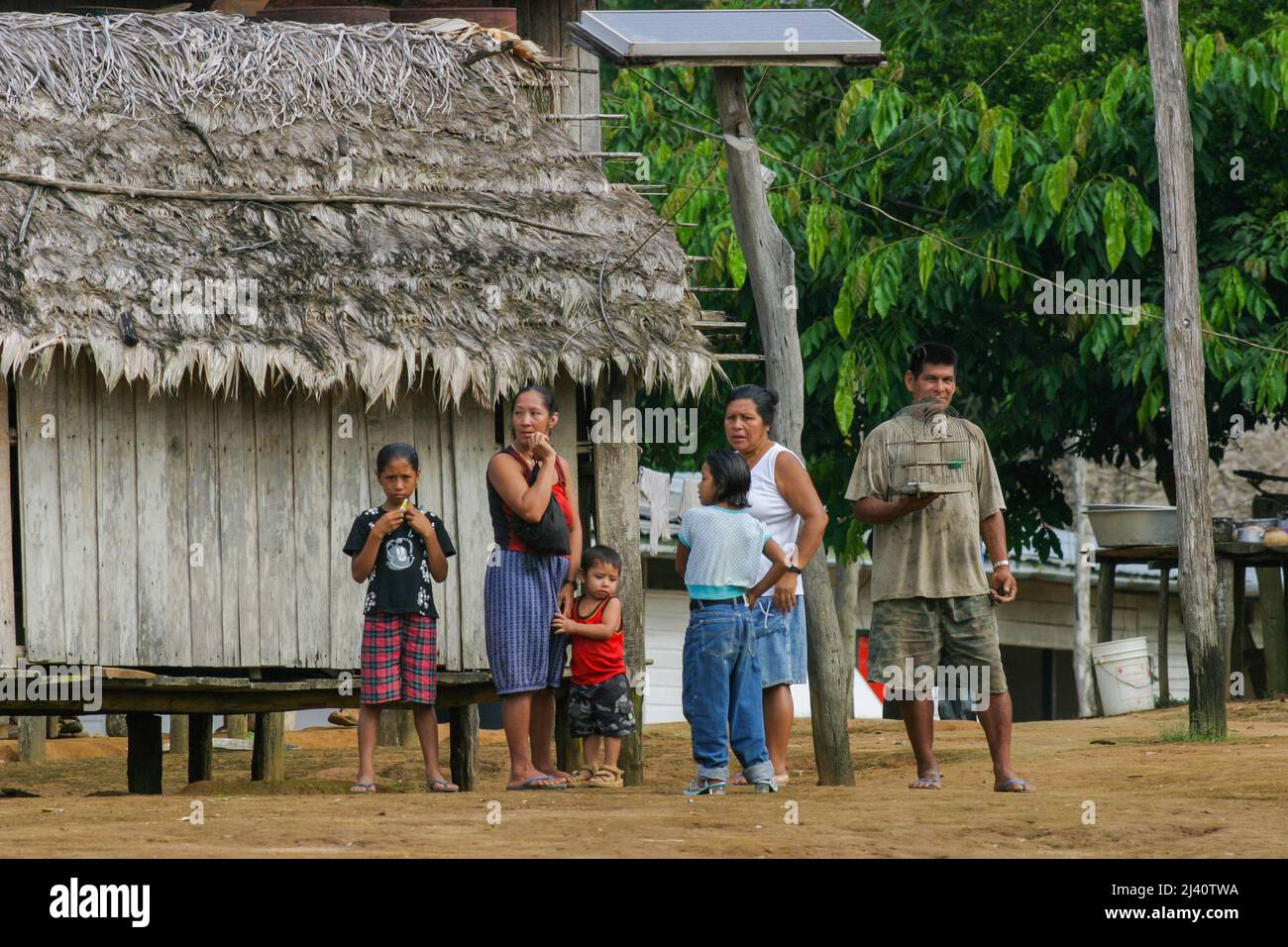 Surinam, Tepu. People of the Trio tribe in their village. A woman is ...