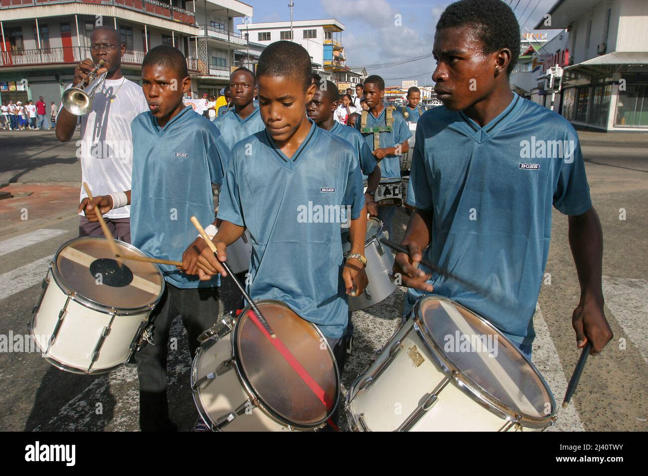 Surinam, Paramaribo - a brassband walks through the centre of the city ...