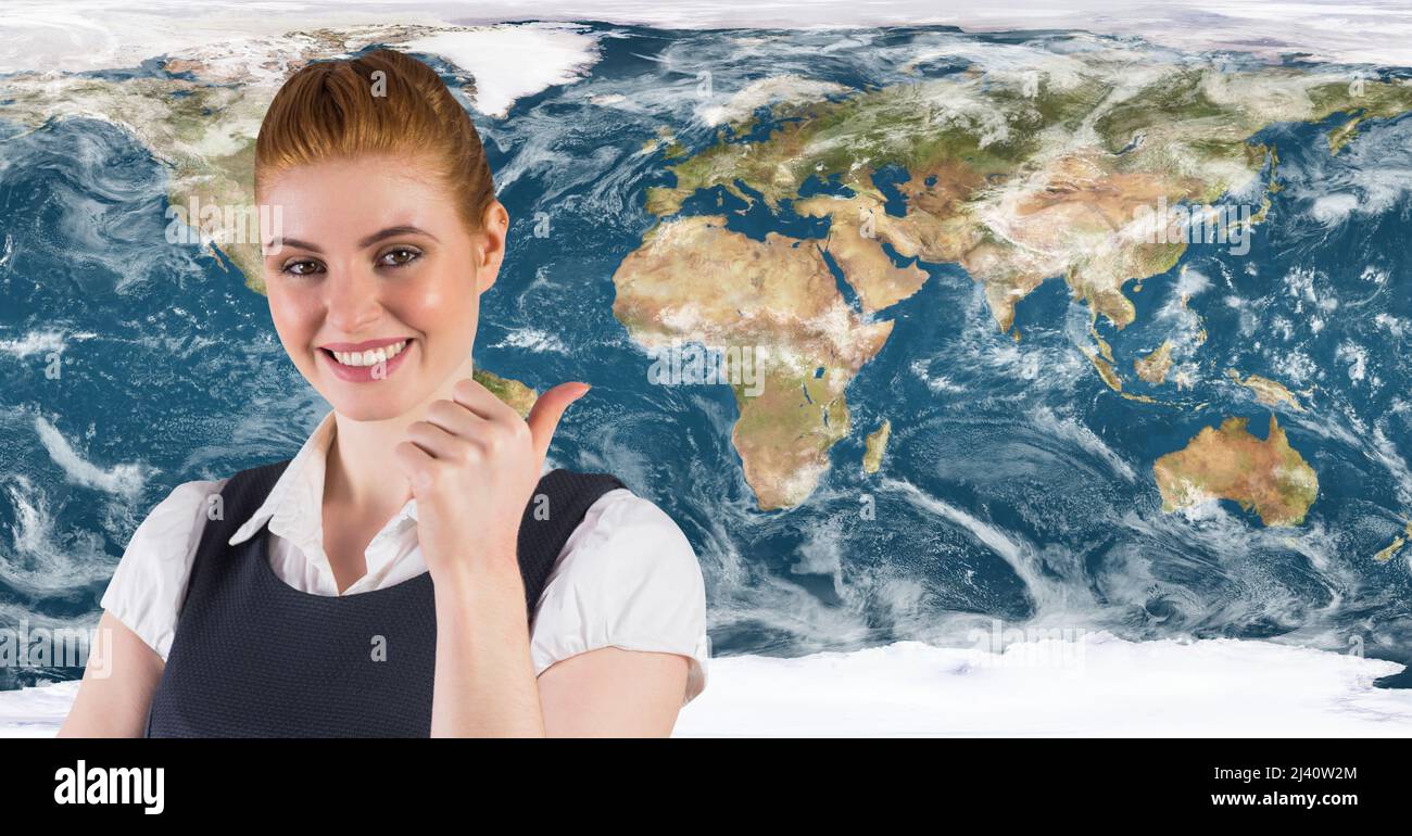 Portrait of caucasian woman showing thumbs up against world map in ...