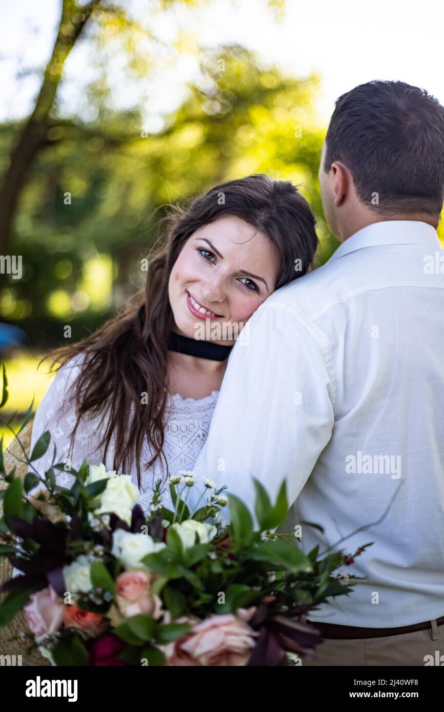 nice portrait of beautiful and young groom and bride outdoors Stock ...