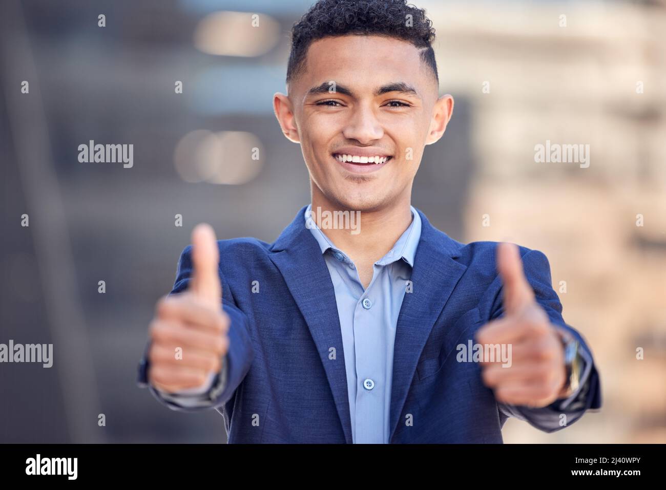 Thumbs up young businessman outside hi-res stock photography and images ...