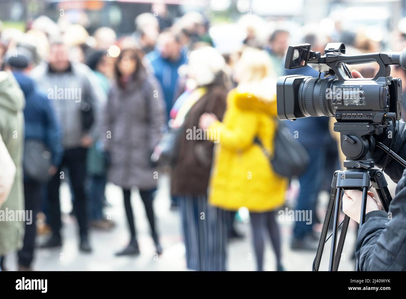 Shooting crowd of people with a video camera Stock Photo - Alamy