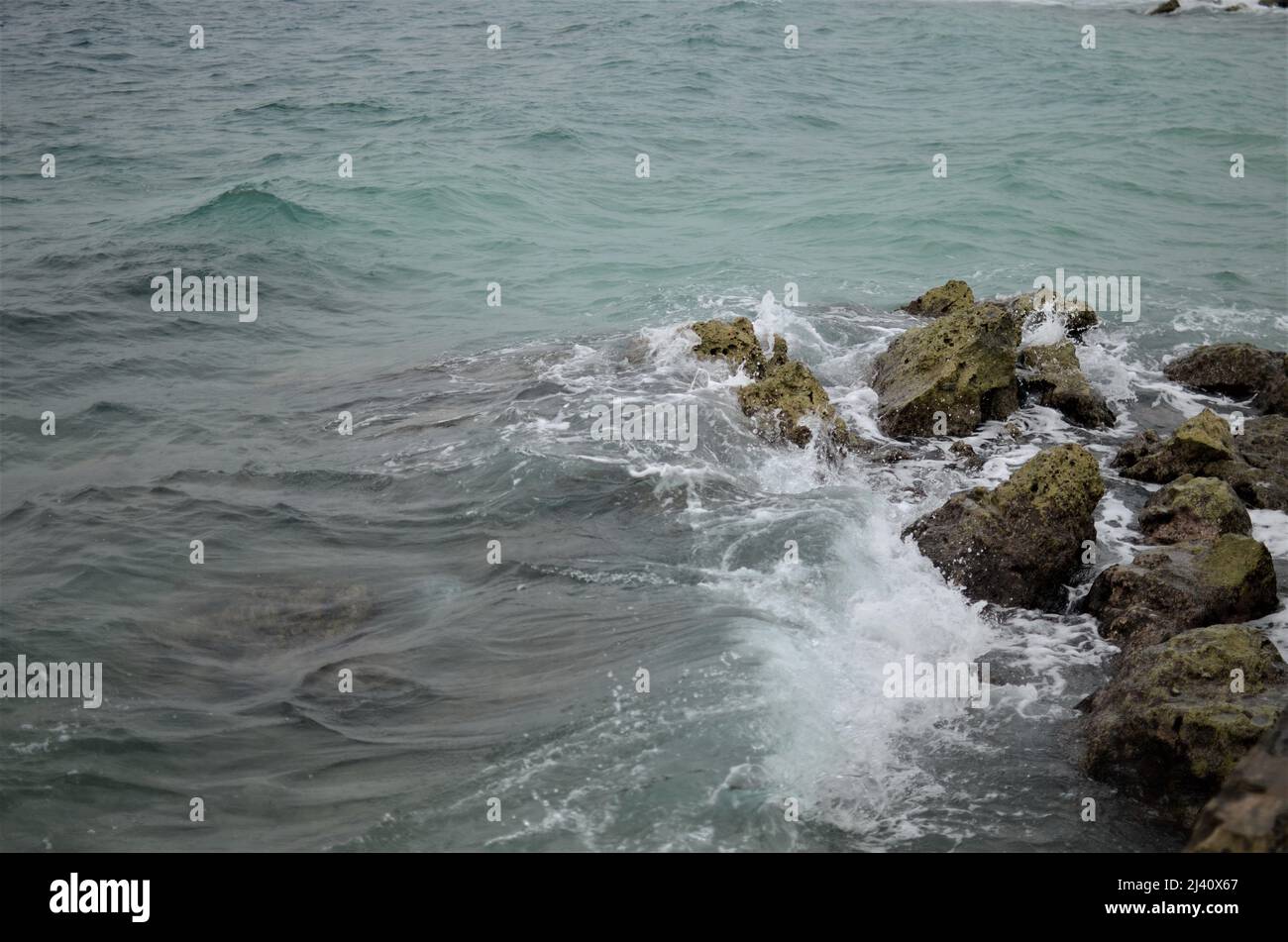 Sea waves hit the rocks Stock Photo - Alamy
