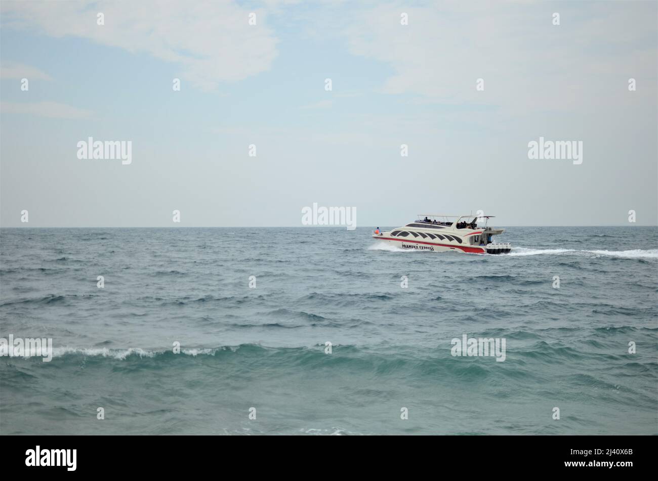 Motor boat speeding up on water Stock Photo - Alamy