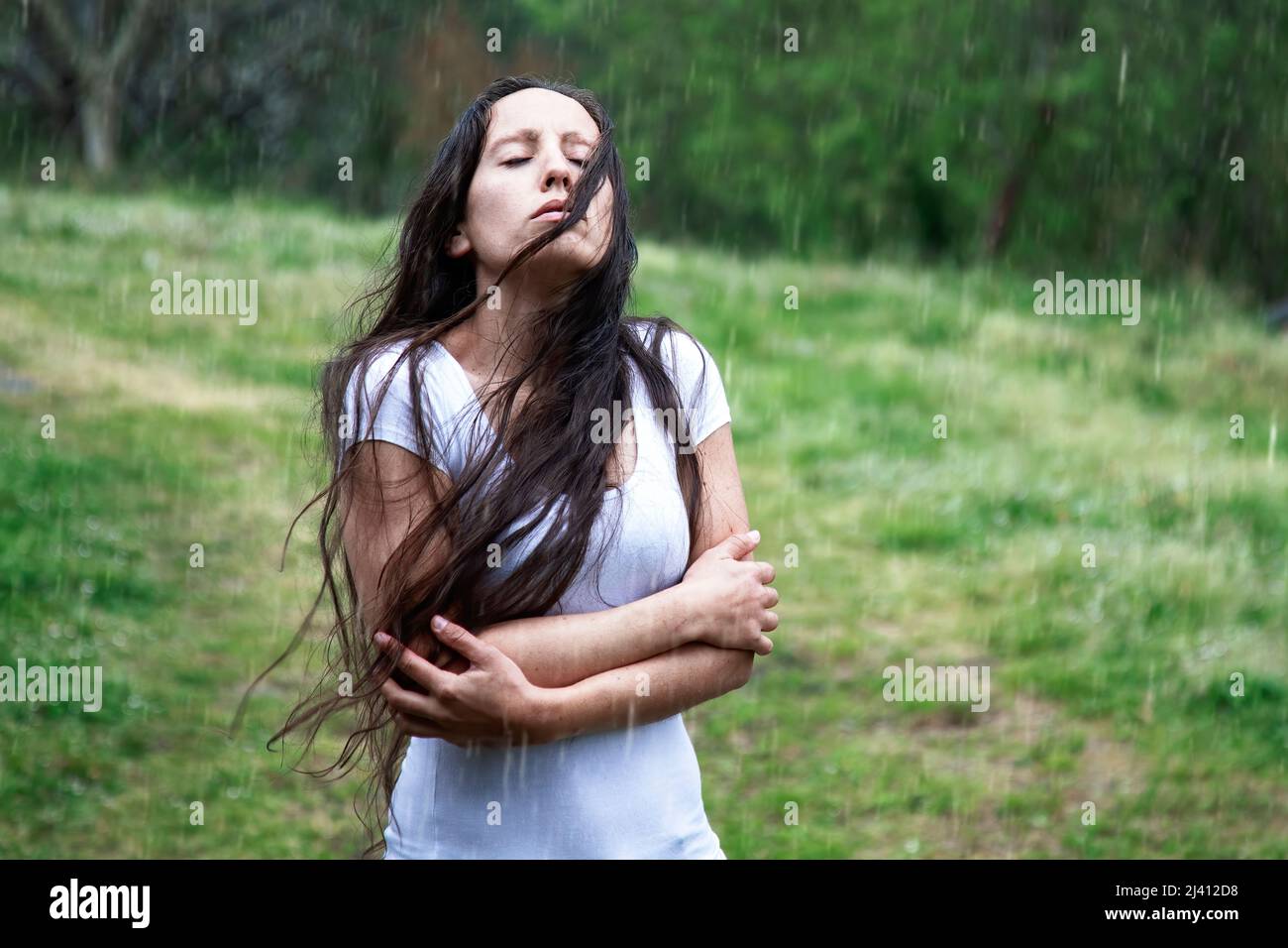 Woman hugging herself sad hi-res stock photography and images - Alamy