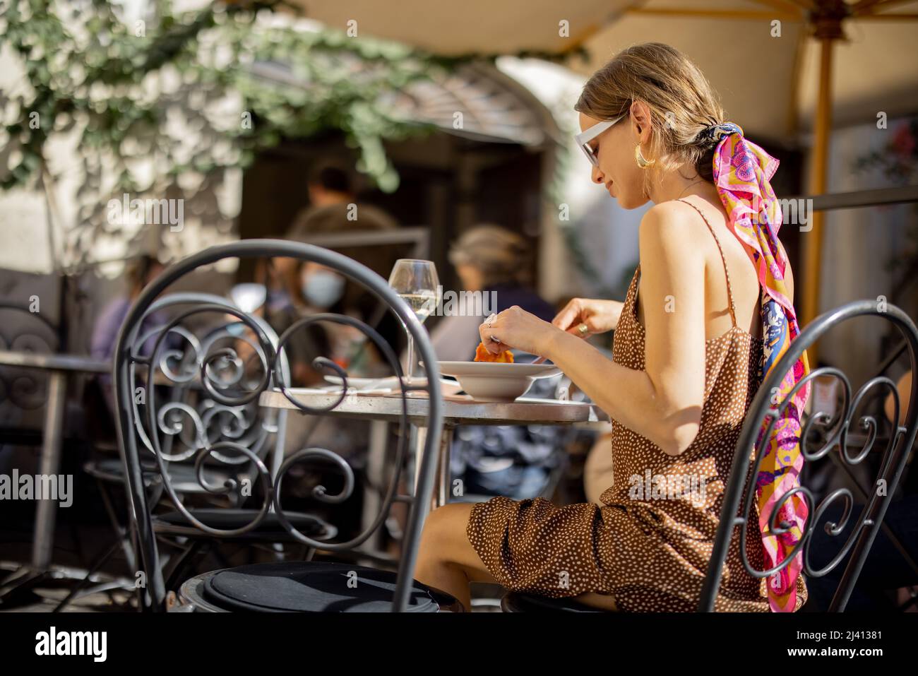 Woman eating italian pasta at restaurant on the street in Rome Stock ...