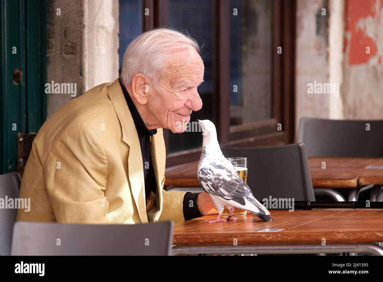 The man and the pigeon Stock Photo - Alamy