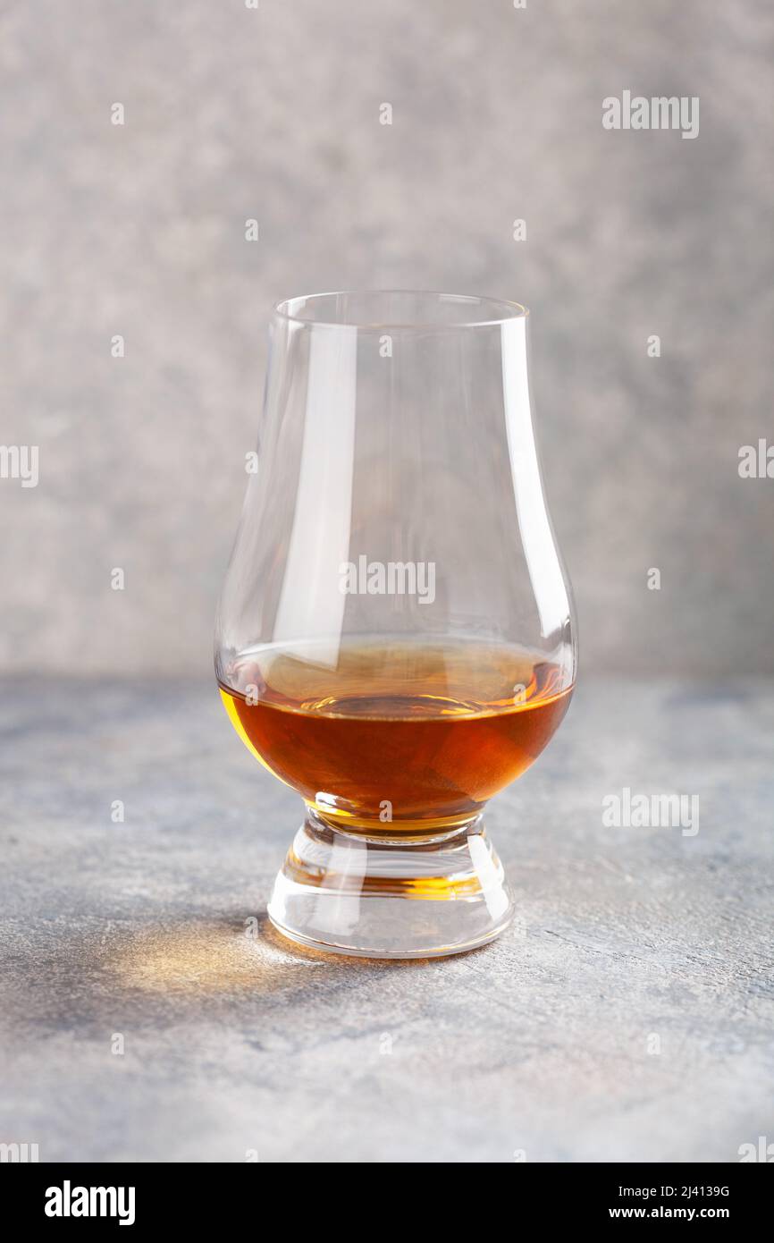 glass of whisky spirit brandy on gray concrete background Stock Photo ...