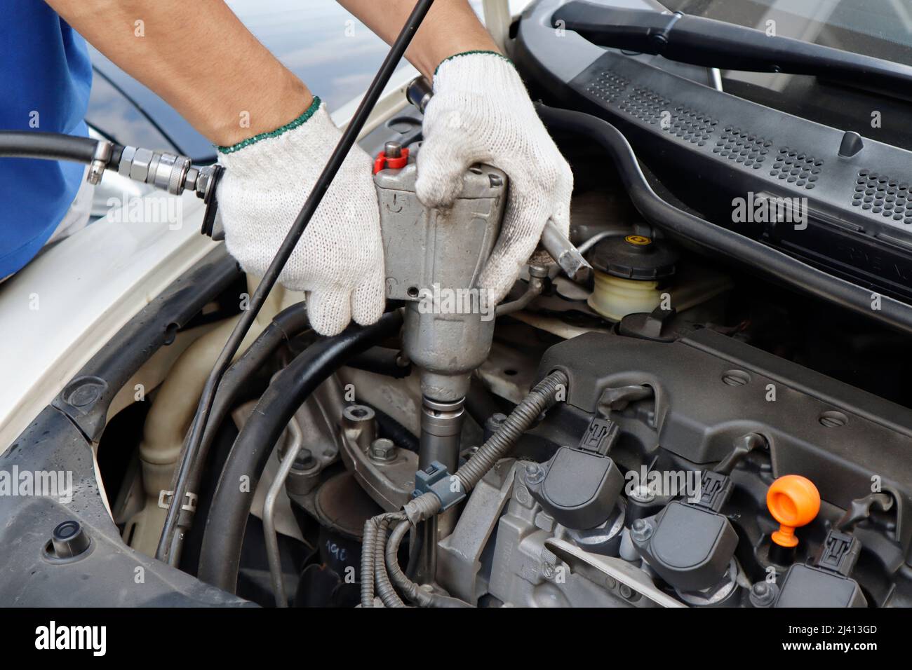 hand of mechanic with hand of mechanic with wrench torque to tightening ...