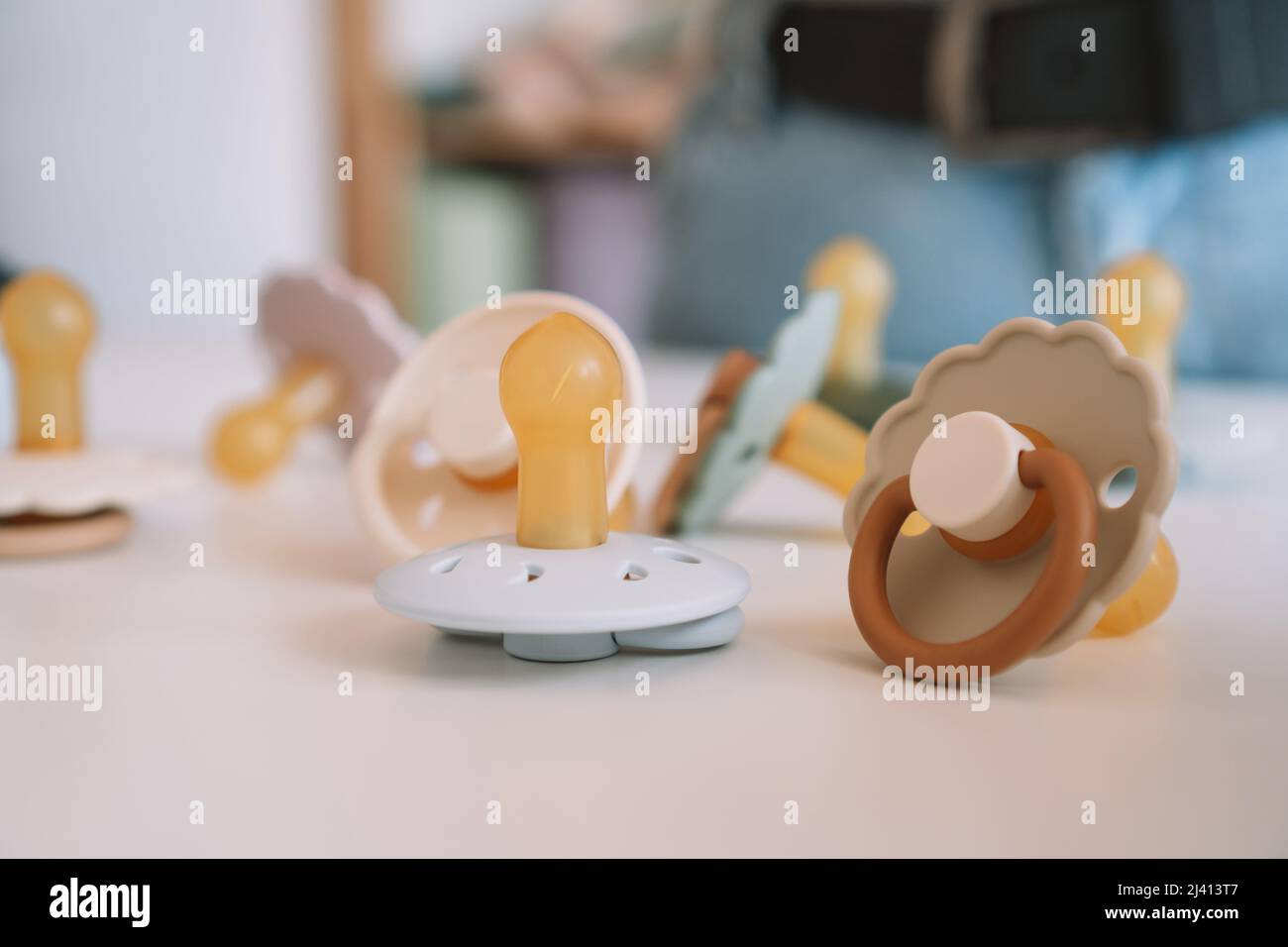 Craft, handmade colorful silicone pacifiers for newborn babies on white ...