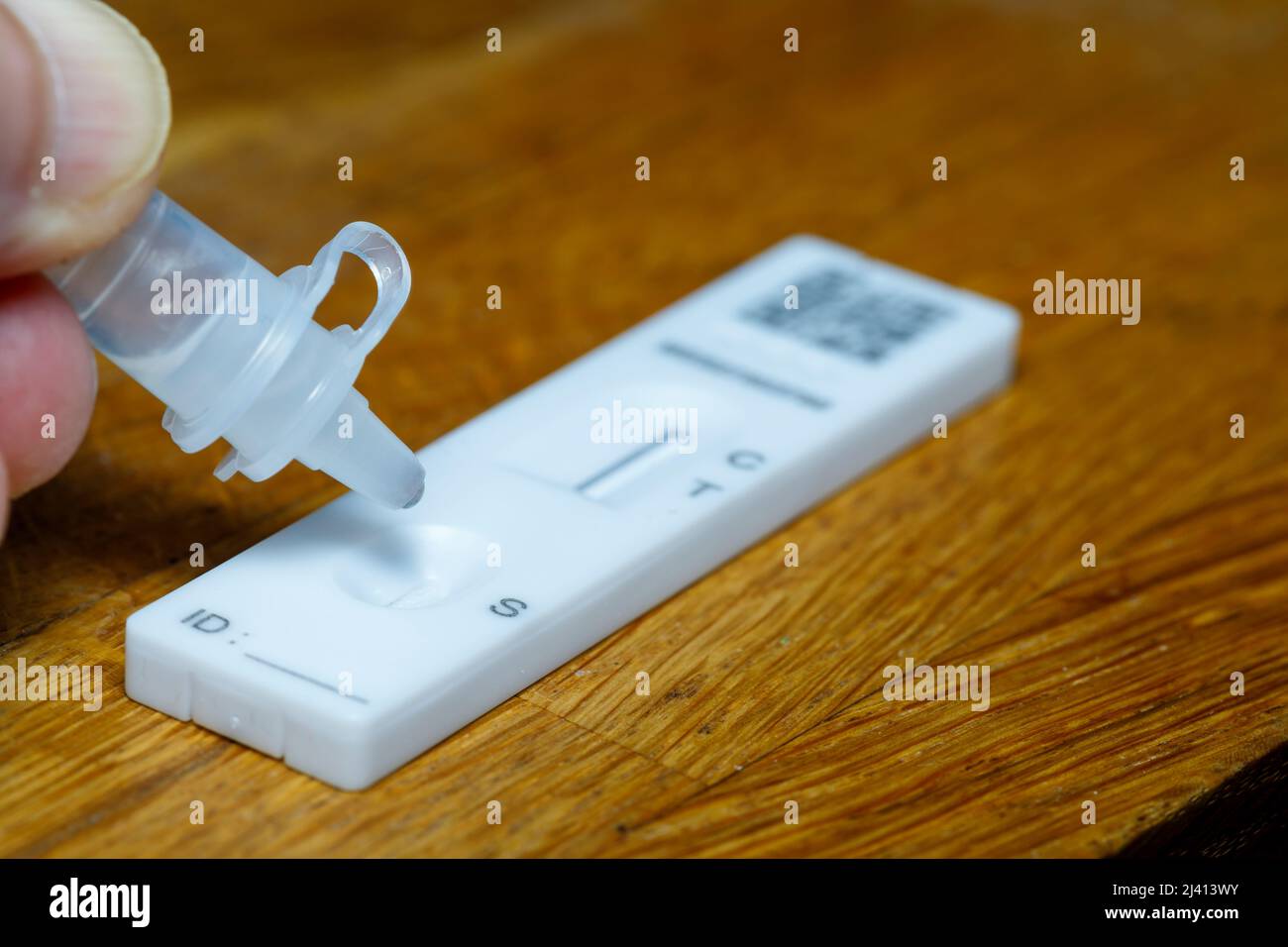 Person carrying out a Lateral flow test for Coronavirus/Covid-19, also ...