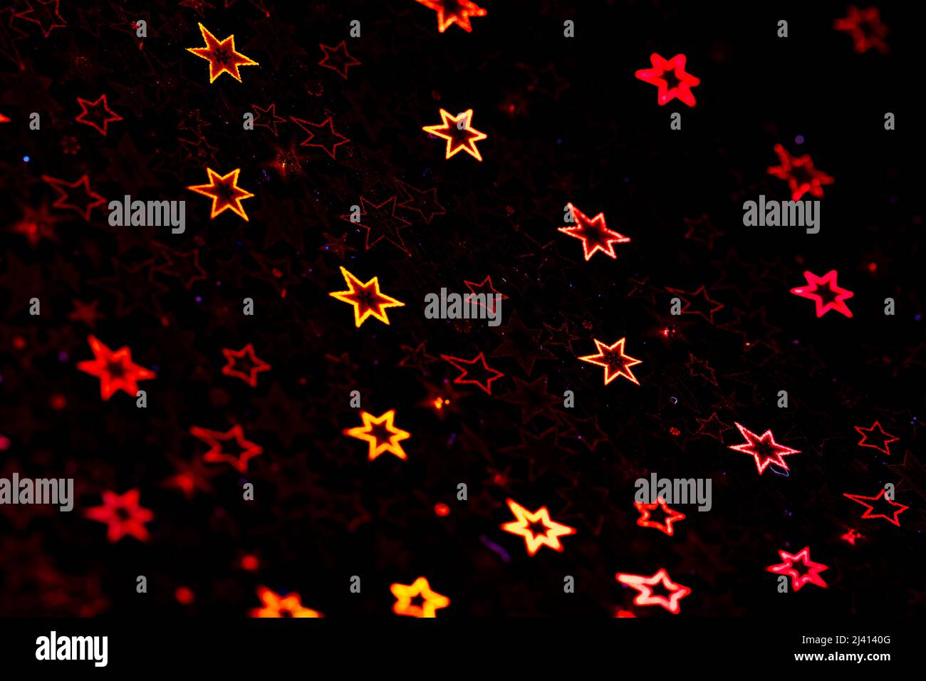 red holographic stars abstract patterned background for design purpose ...