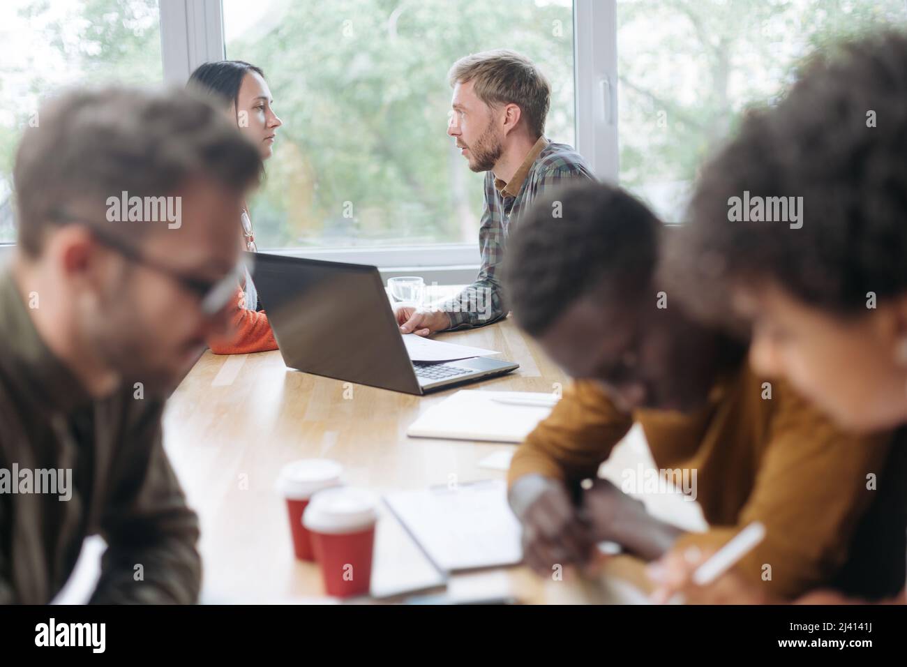 employees at their workplaces in the coworking center Stock Photo - Alamy