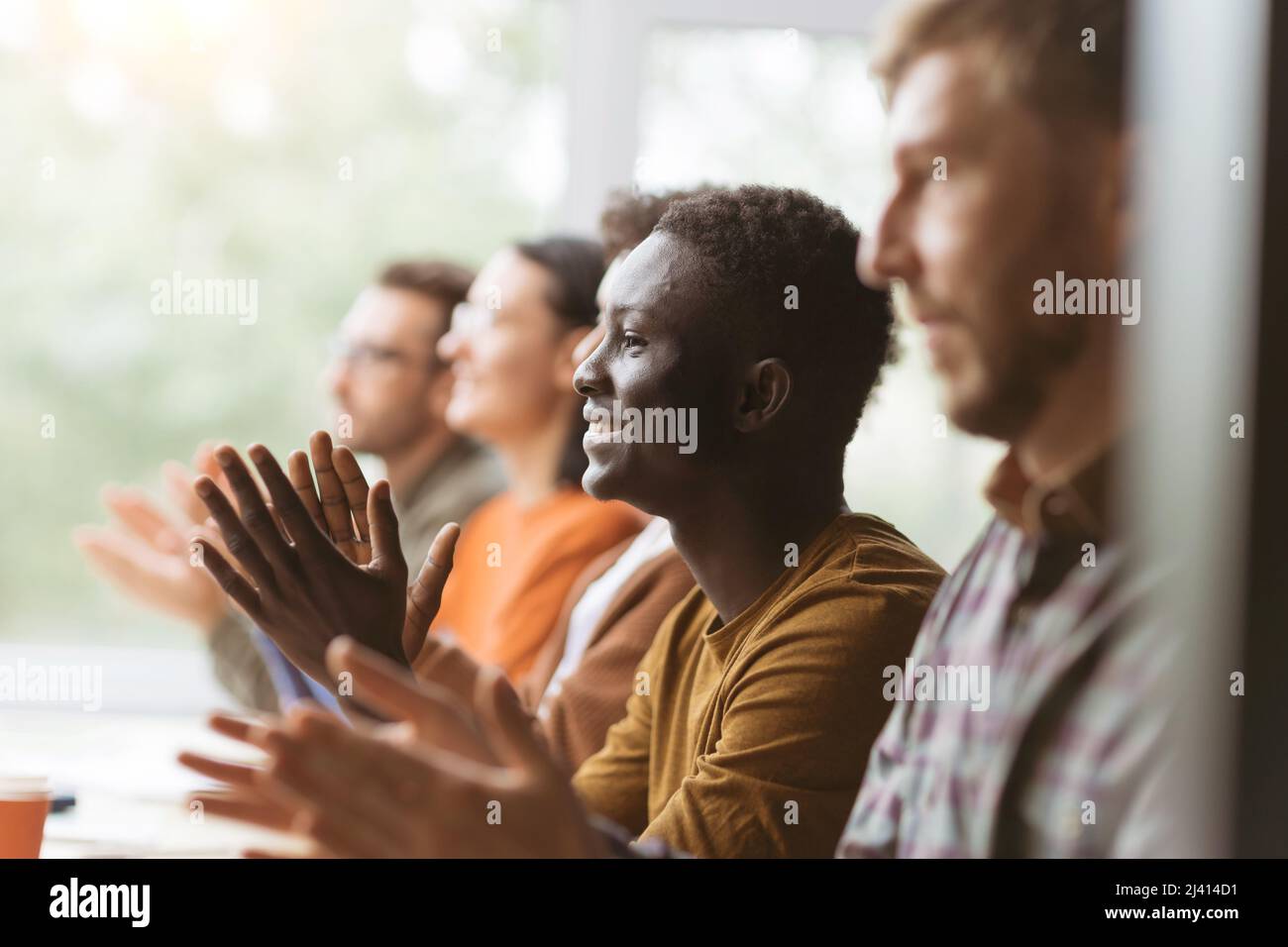 Happy employees greeting congratulating hi-res stock photography and ...