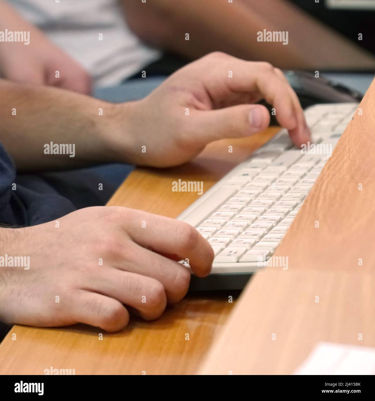 Mans hands behind computer hi-res stock photography and images - Alamy