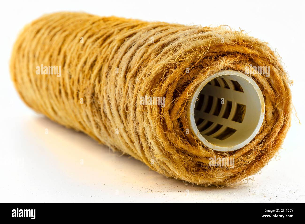 Dirty from rust water string filter, isolated on a white background ...
