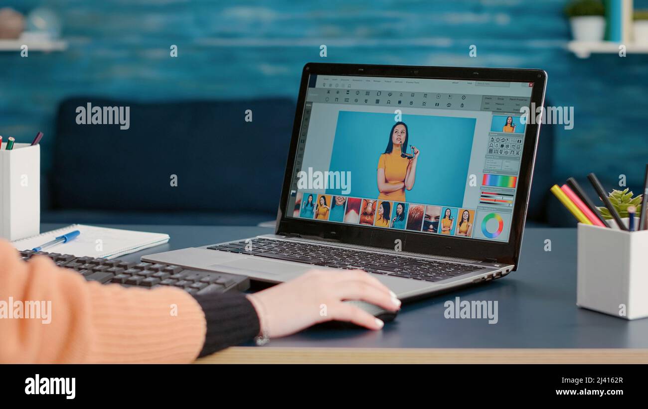 Photography student editing picture on retouching software, working on ...
