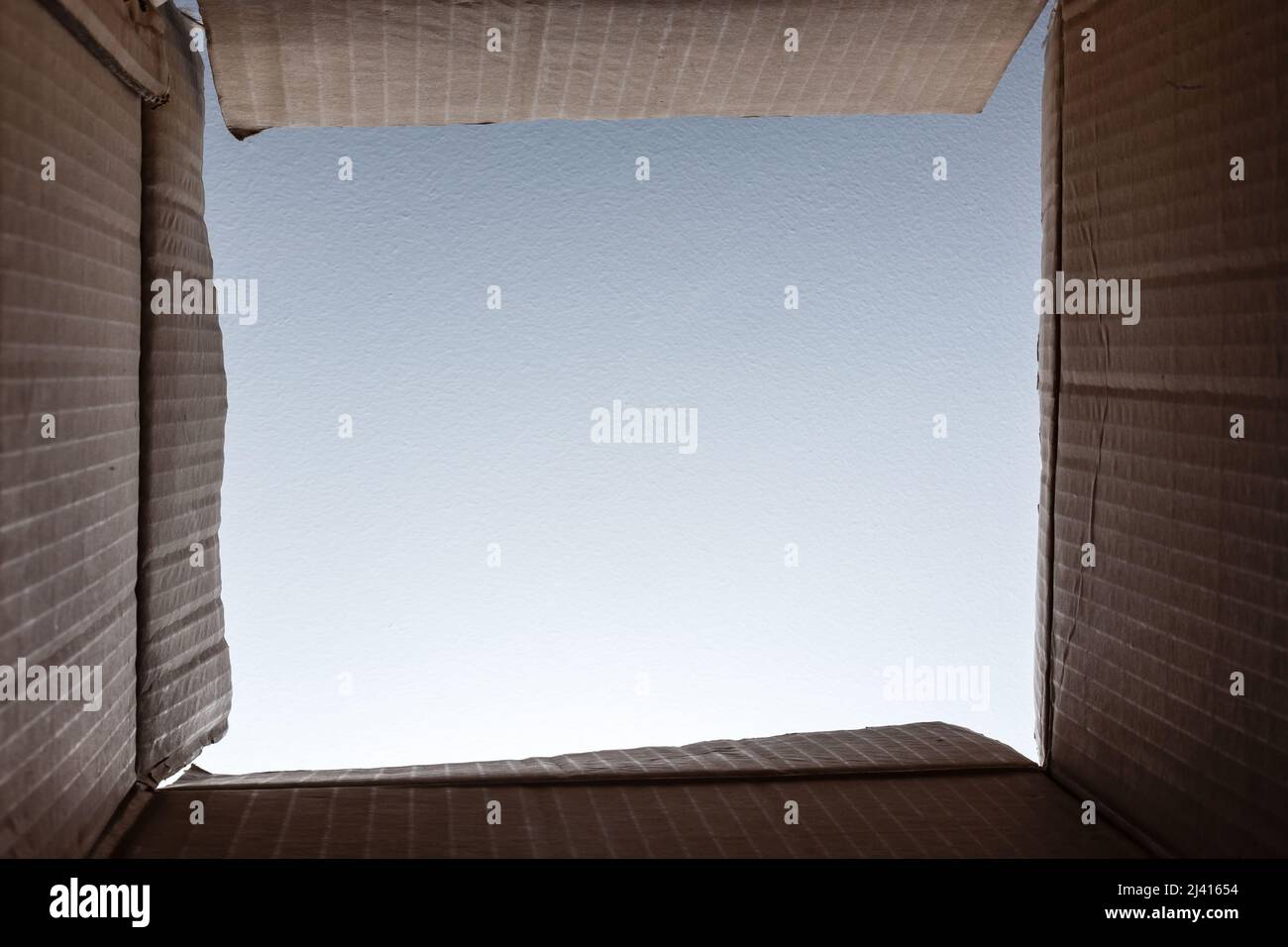 Empty cardboard box interior from below Stock Photo - Alamy