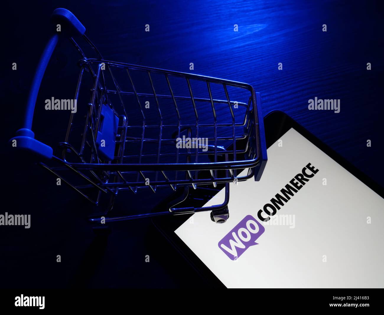 KYIV, UKRAINE - March 30, 2022. Tablet with WooCommerce eCommerce ...