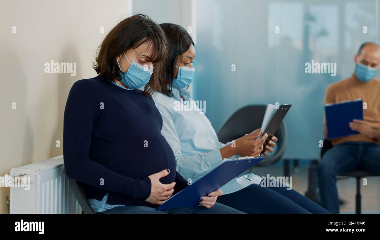Woman expecting child and waiting to join executive job interview ...