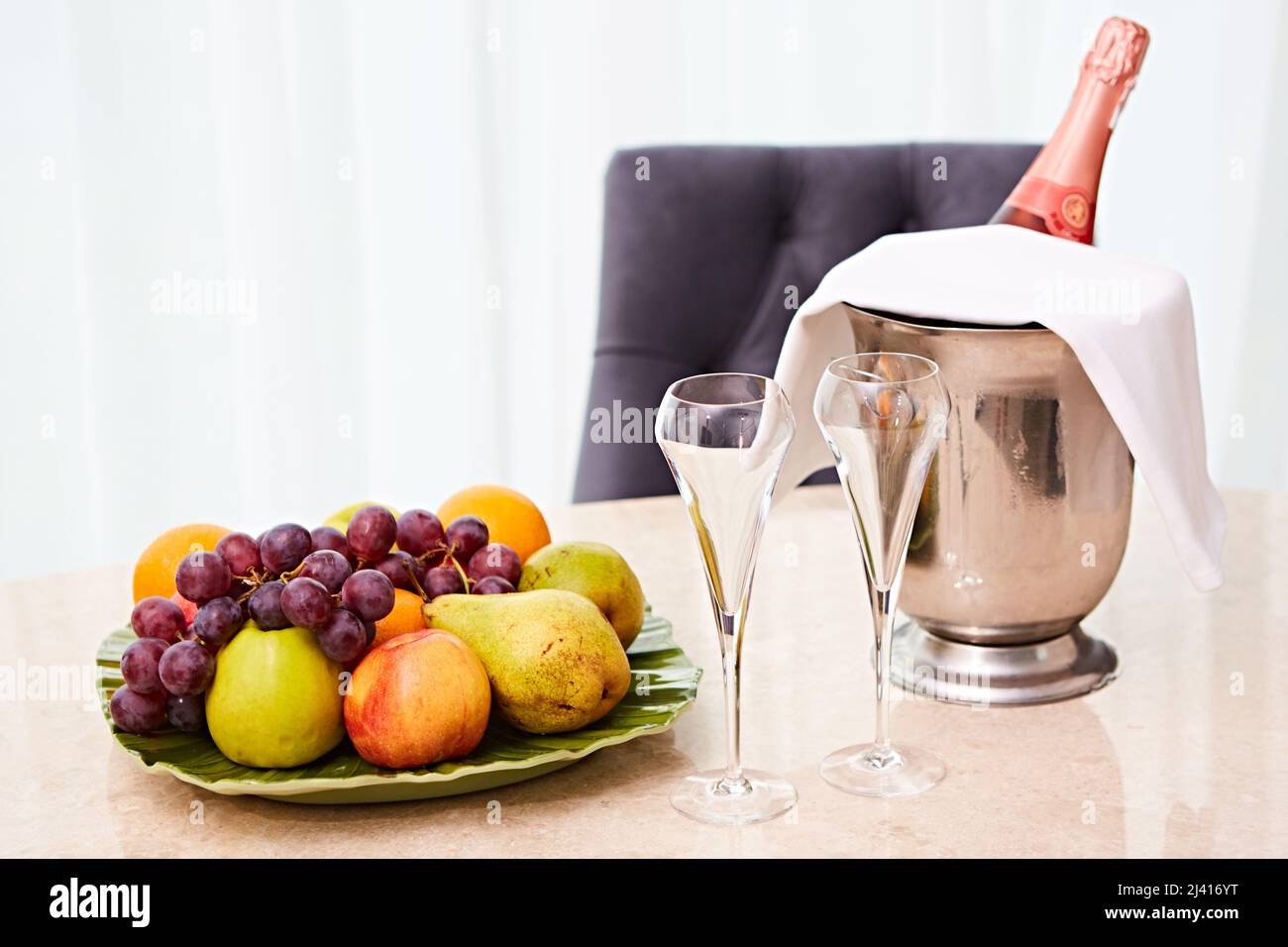 Champagne in a Hotel Room, Ice Bucket, Glasses and Fruits on a Plate ...