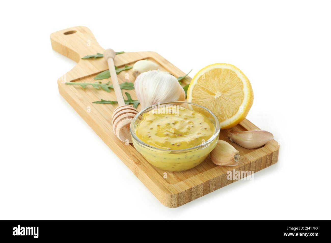 Composition of cooking mustard honey sauce isolated on white background ...