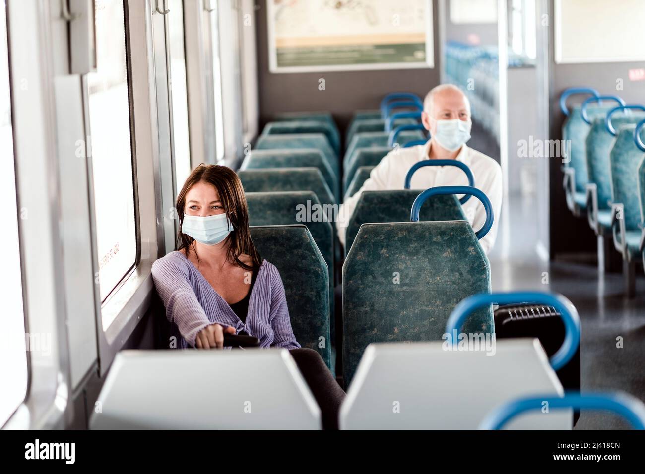 Happy mask commuters hi-res stock photography and images - Alamy
