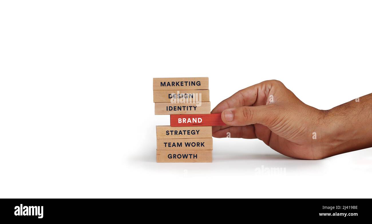 business hand arranging wood block with word BRAND concept Stock Photo ...