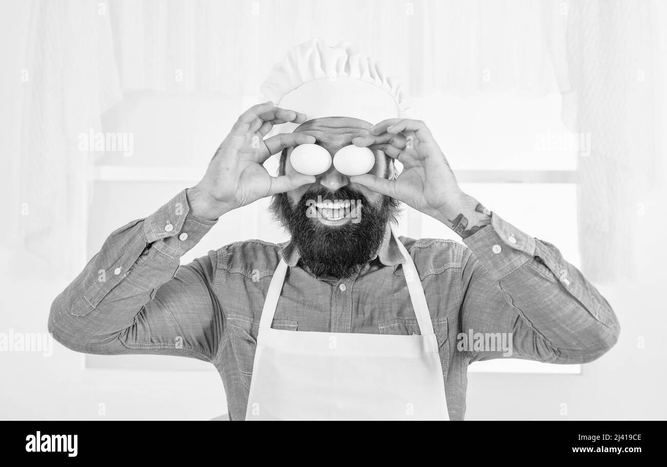 handsome man with beard and moustache cooking food. professional ...