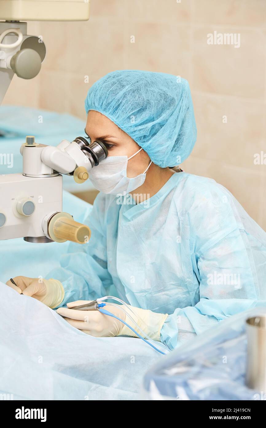 Ophthalmology laser microscope operation. Doctor surgery in clinic ...