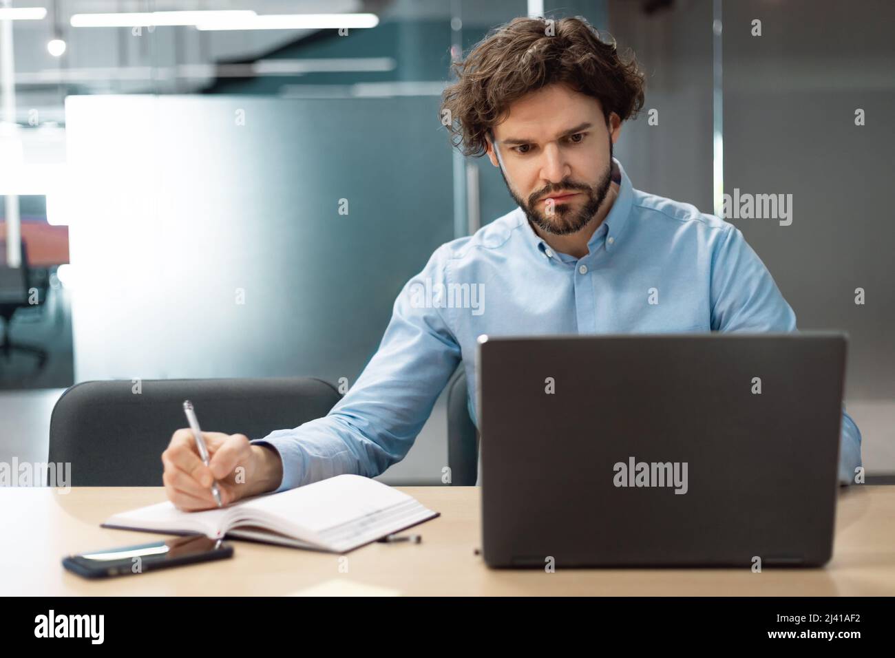Portrait focused man writing hi-res stock photography and images - Alamy