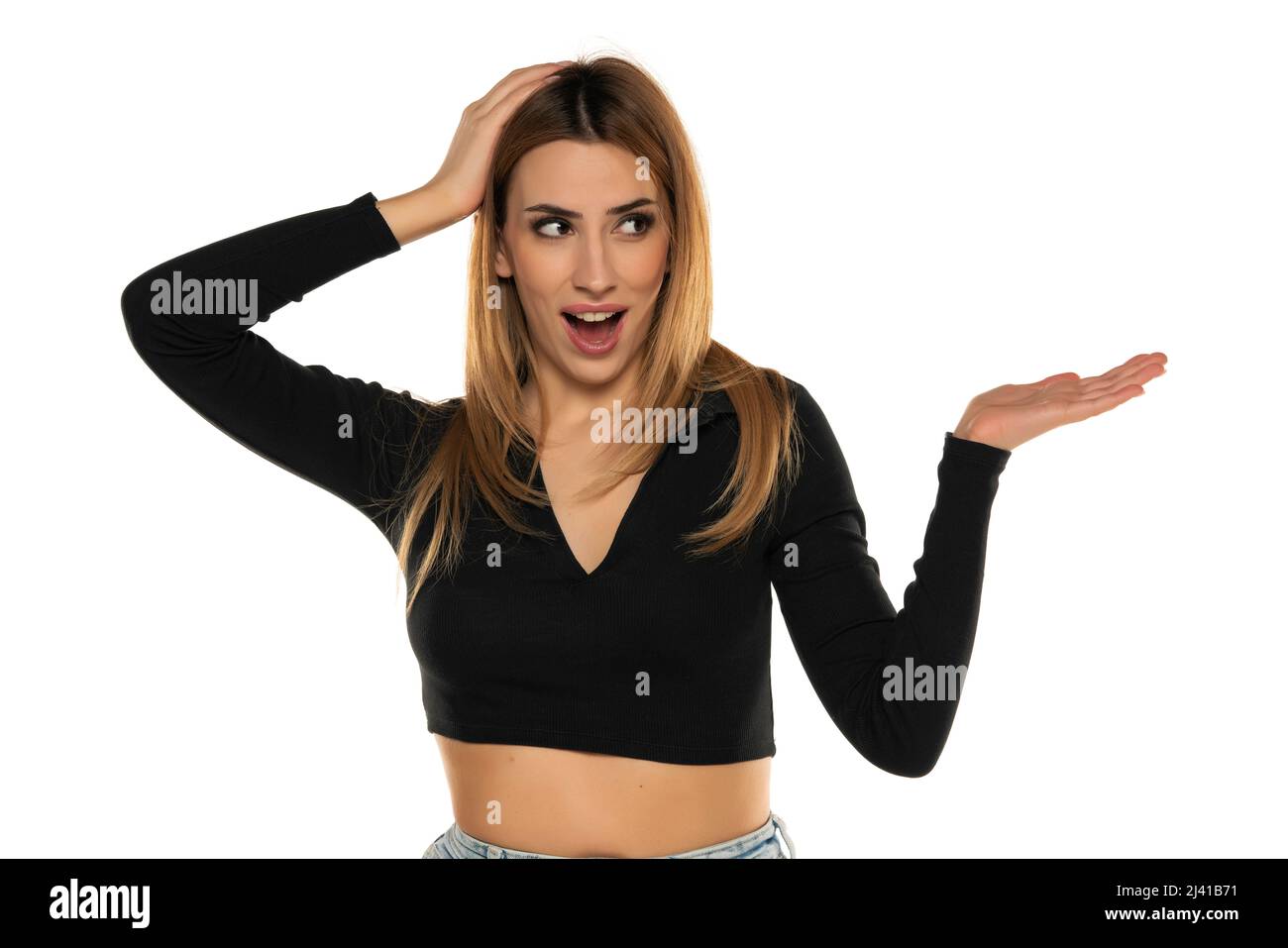 Young happy advertizing excited pretty woman advertize imaginary ...