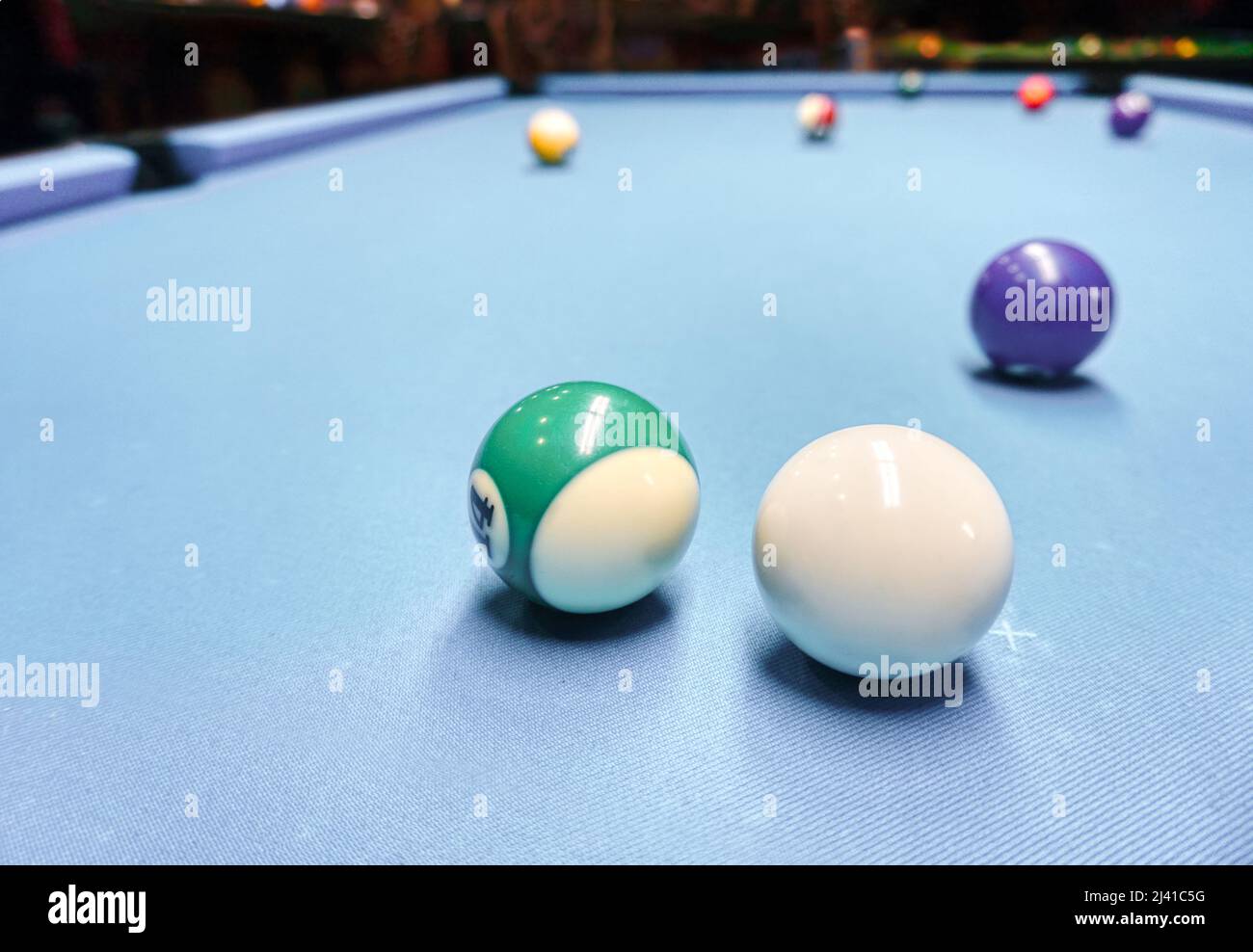 Billiards game - white and colorful balls on a table Stock Photo - Alamy
