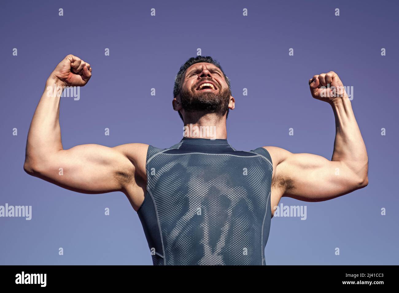 happy athletic muscular man has biceps and triceps, sport success Stock ...