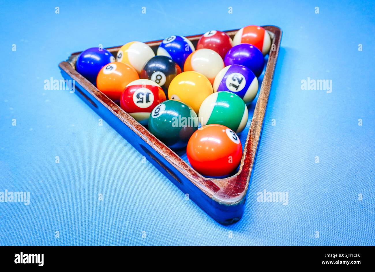 Billiards game - balls in wooden triangle Stock Photo - Alamy