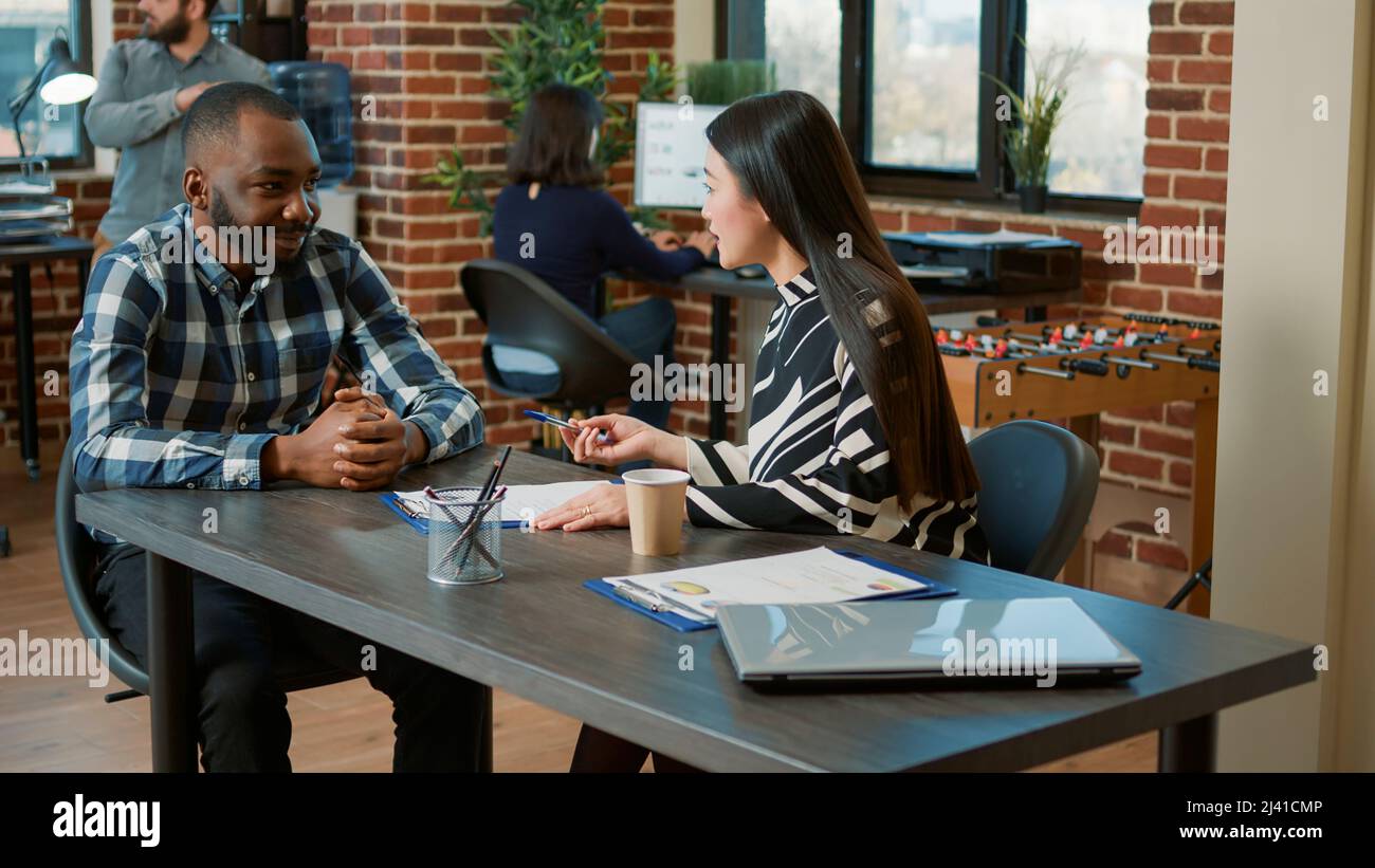 HR employee greeting job candidate at recruitment interview, talking ...