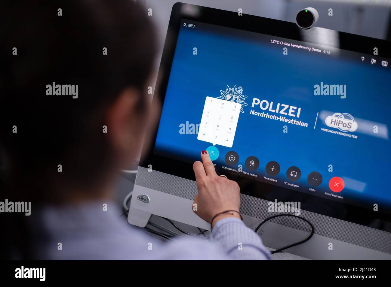 Duesseldorf, Germany. 11th Apr, 2022. A policewoman dials into a ...