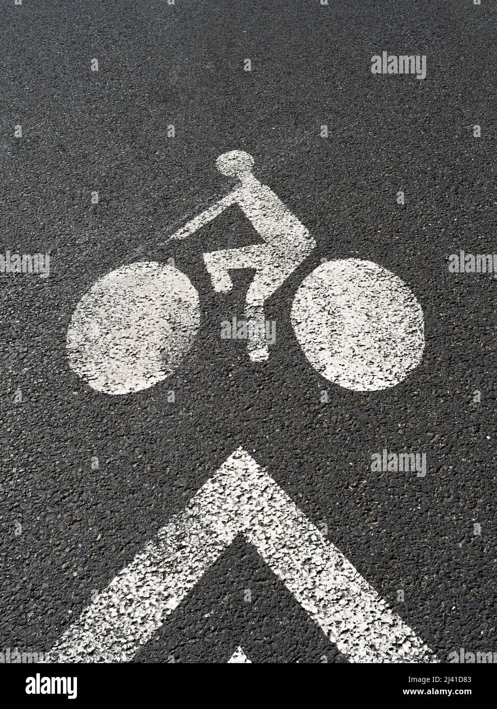 Road sign painted on the ground indicating bike lane Stock Photo - Alamy