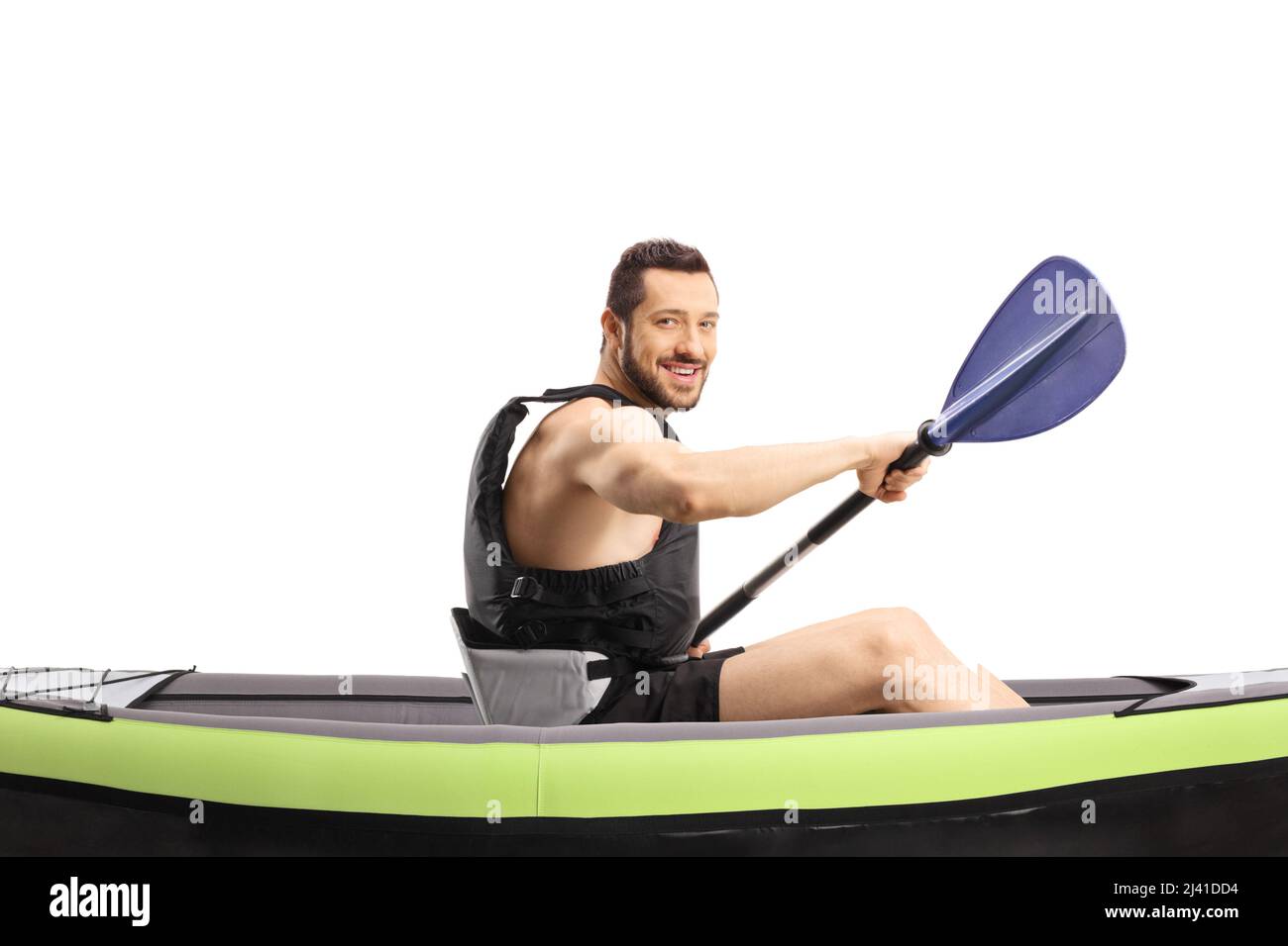 Man paddling a kayak and smiling at the camera isolated on white ...