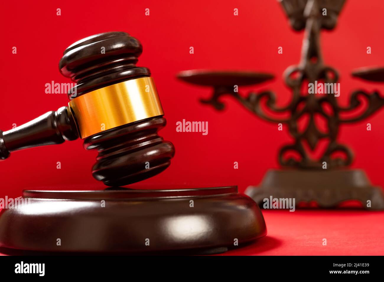 gavel on red with a scale on background Stock Photo - Alamy