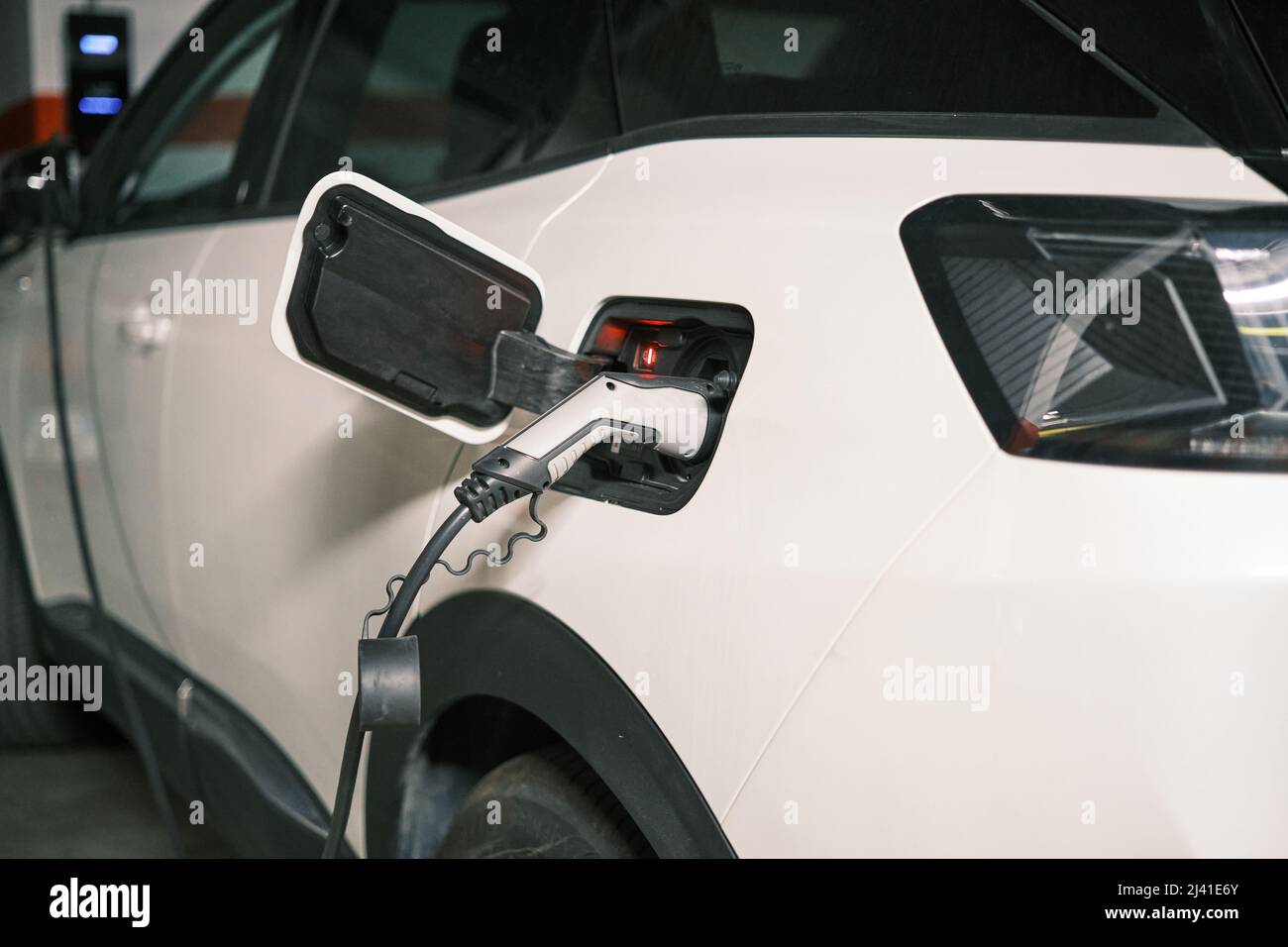 electric car being charged at parking Stock Photo - Alamy